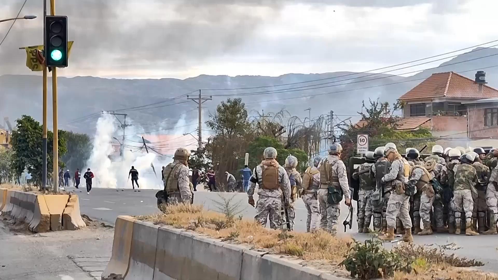 Protesters, police clash in Bolivia after president signs law enabling ...