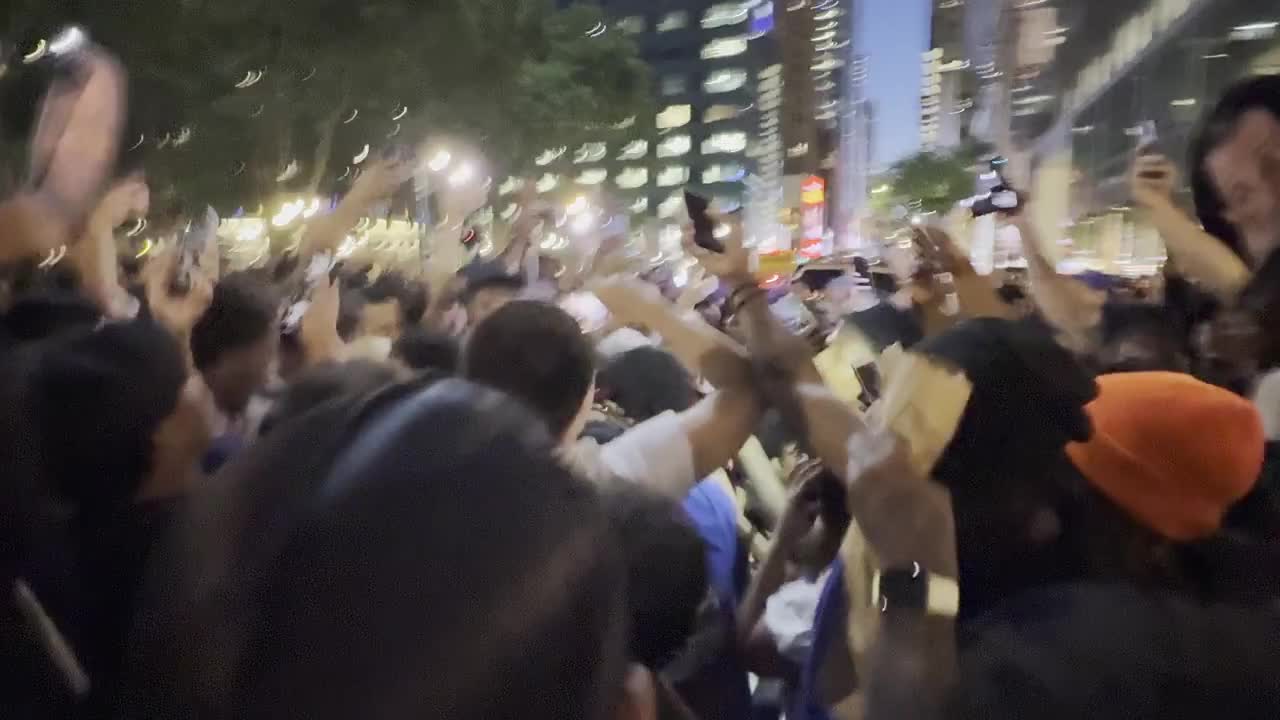 Knicks fans celebrate in street during Game 3 of NBA Finals