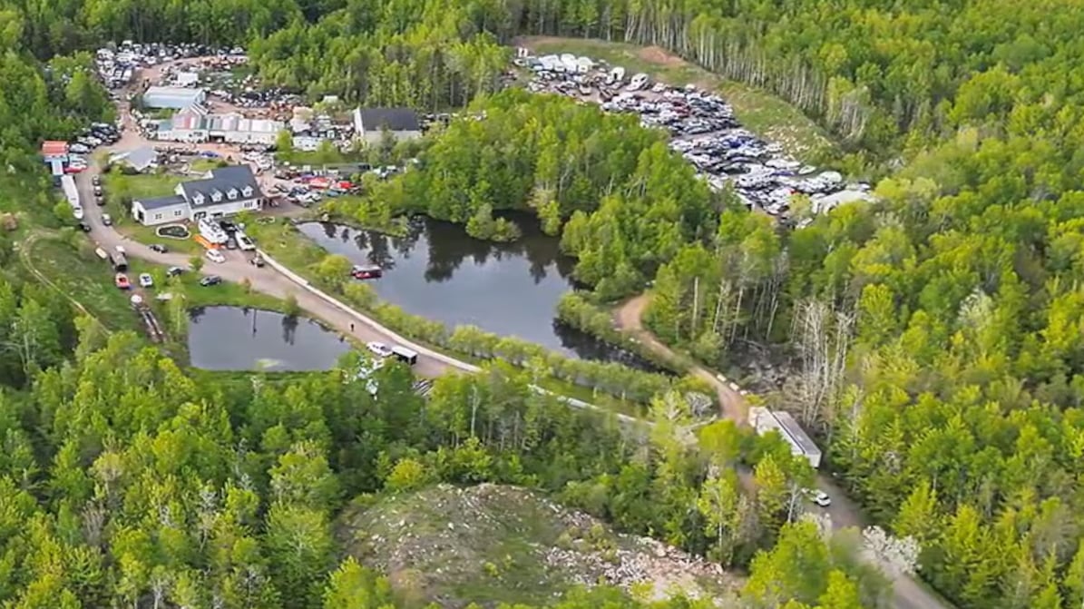 RCMP seize 26 allegedly stolen vehicles, guns, drugs from Moncton property