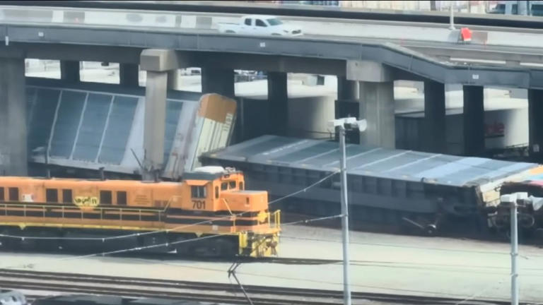 Terrifying moment huge train derails outside Petco Park before smashing ...