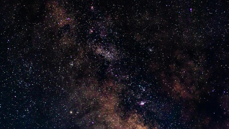 Space is completely silent, because there is no air to carry sound