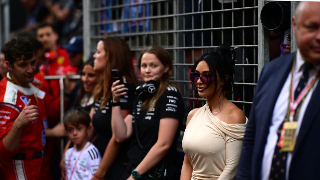 Hamilton’s podium kiss with Kardashian fuels F1 celebrity buzz