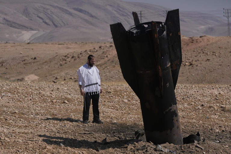 After morning of sirens, Israelis fall back into well-worn war routines
