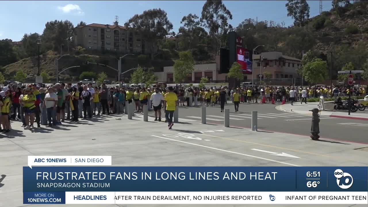 Frustrated fans stand in long lines and heat at Snapdragon Stadium