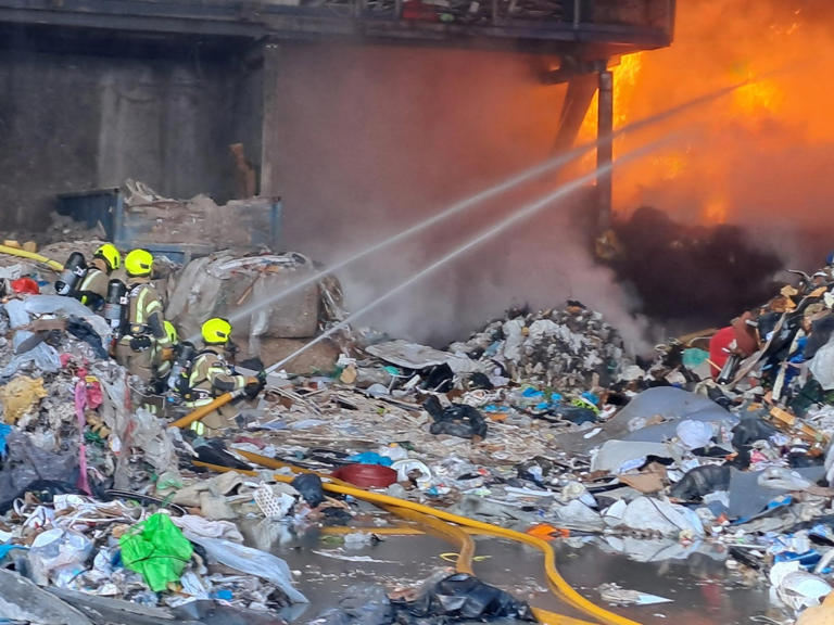 Huge recycling centre fire seen for miles across London