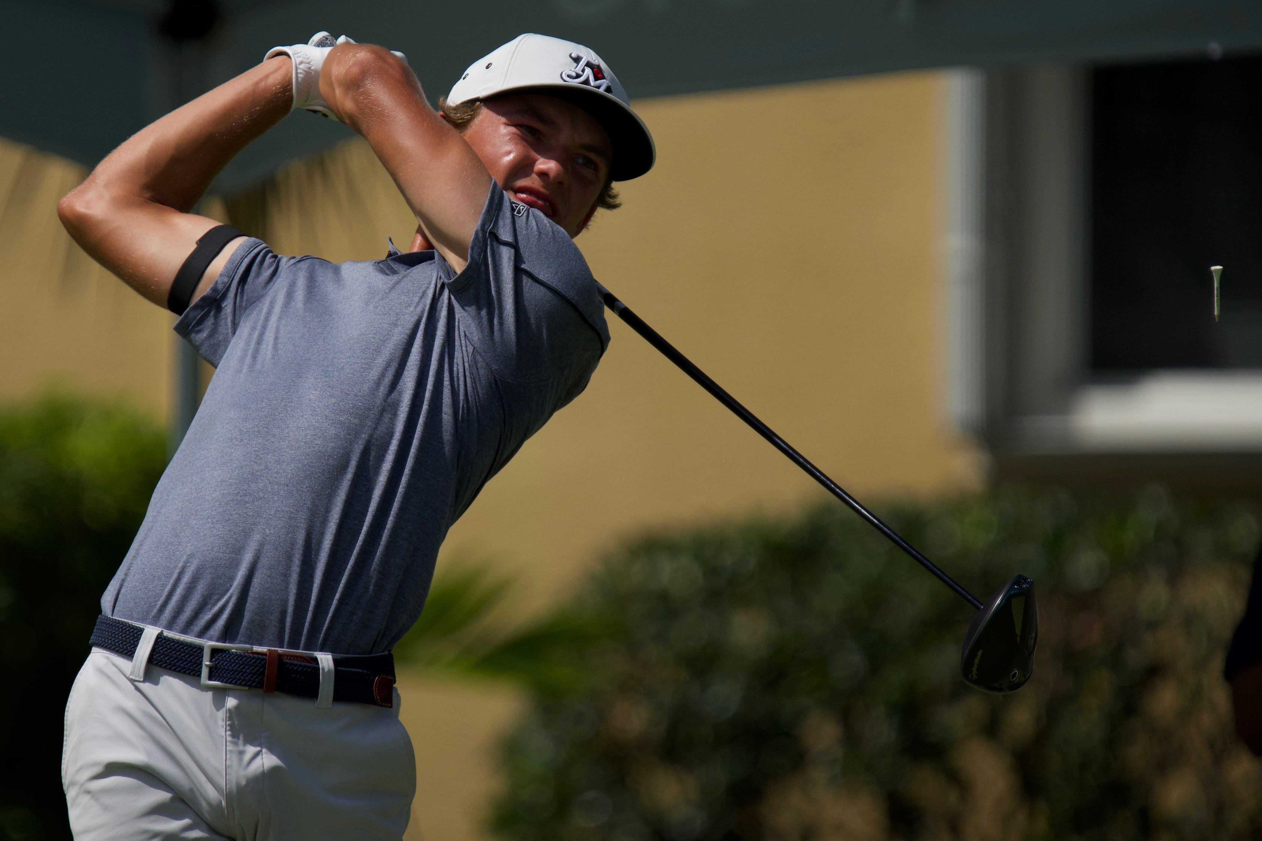 With Charlie Woods on the bag, Miles Russell survives to reach US Open