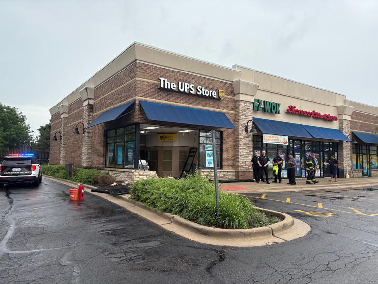 Woman trapped under vehicle, 'catastrophic' damage to UPS store in ...