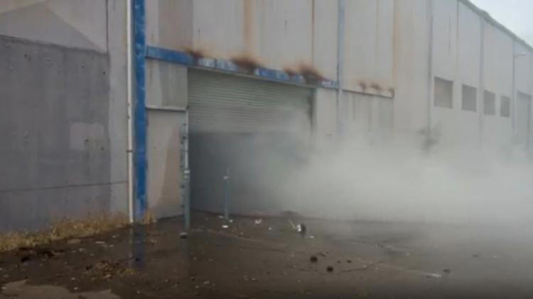 Firefighters work to contain a commercial building fire near Rancho Cordova