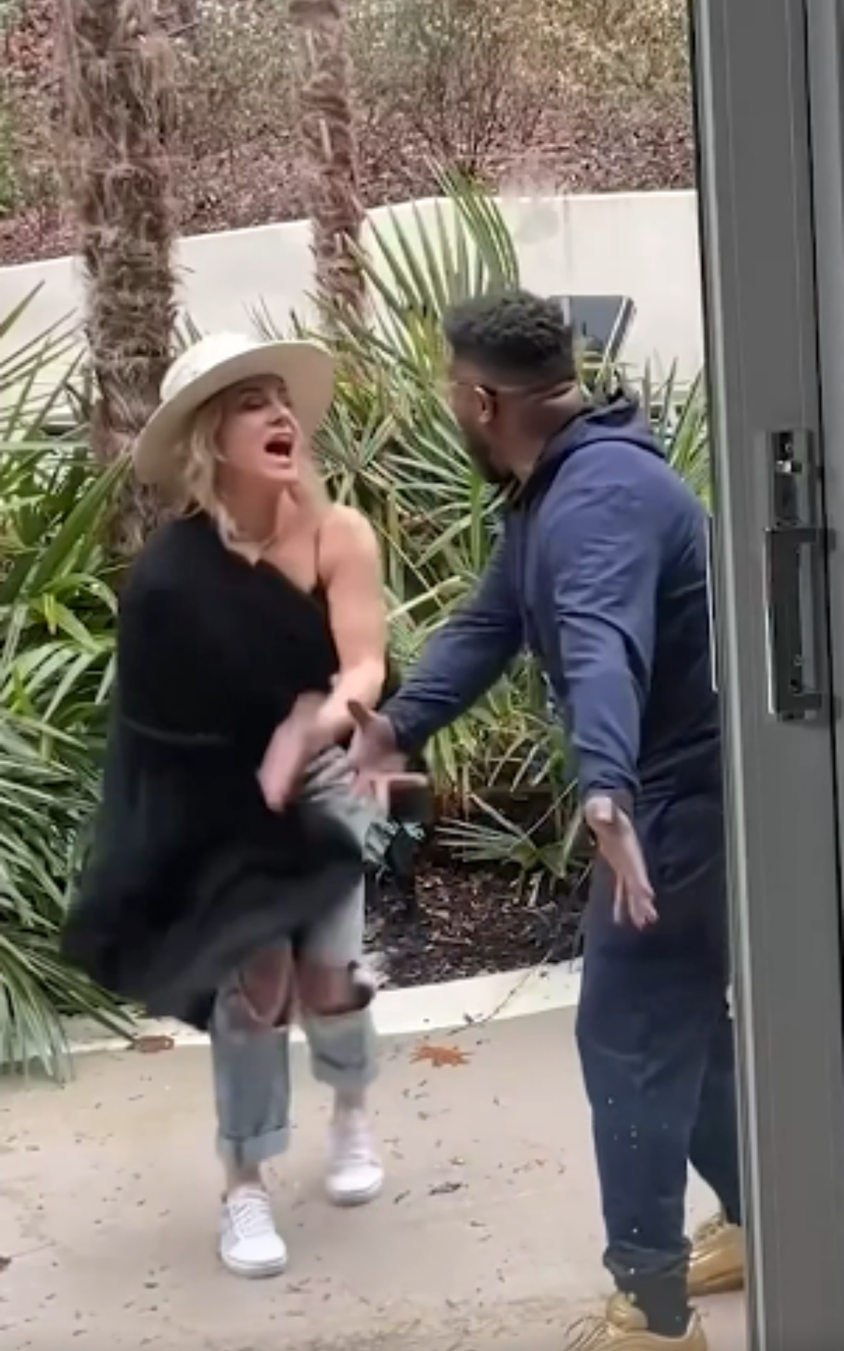 Unexpected door prank leads to a sudden fall moment