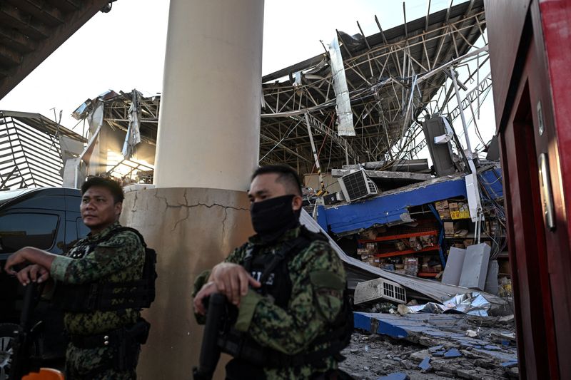 Rescuers race to reach trapped after powerful quake in southern Philippines