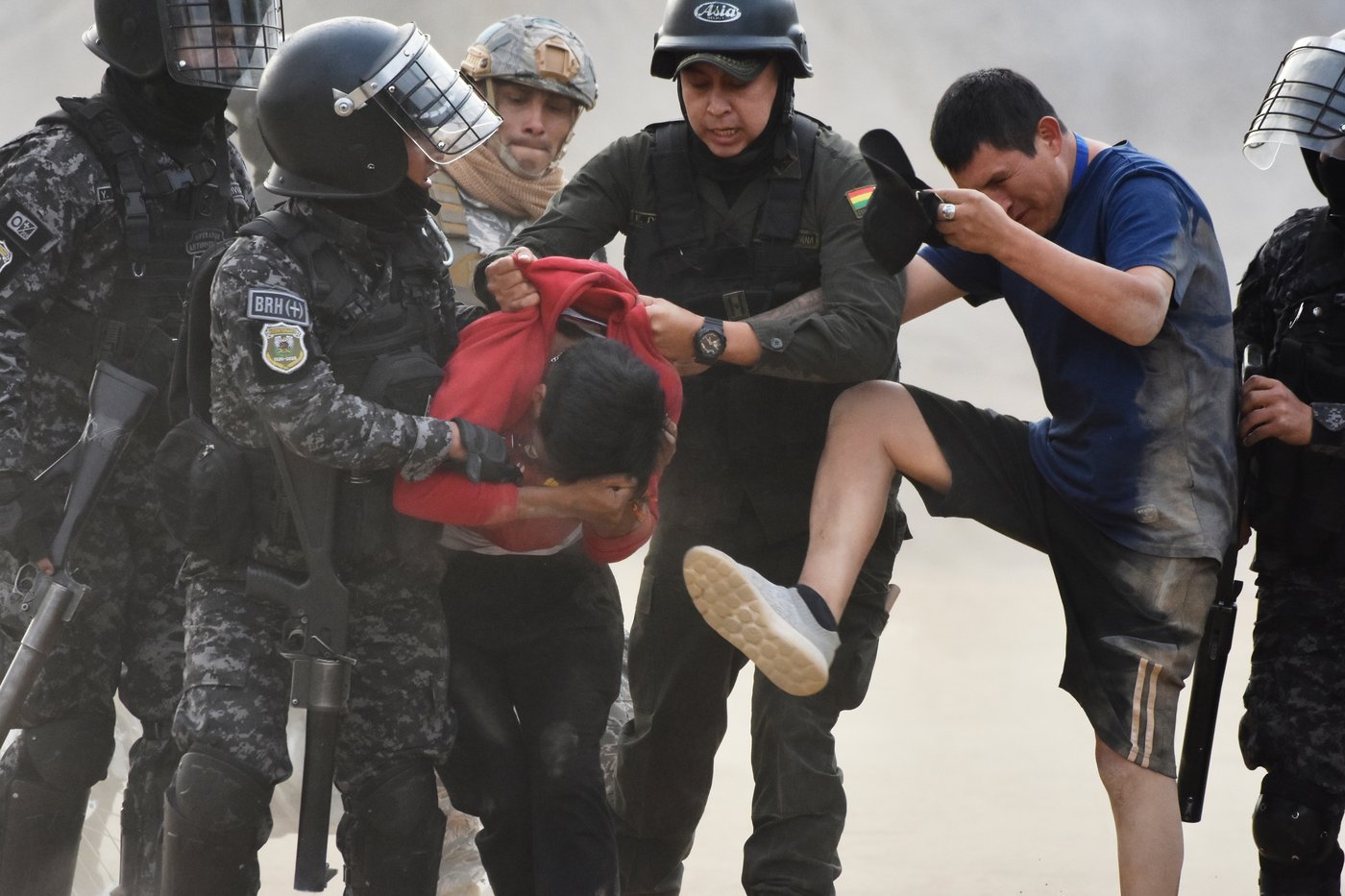 Protesters, police clash in Bolivia after president signs law enabling ...