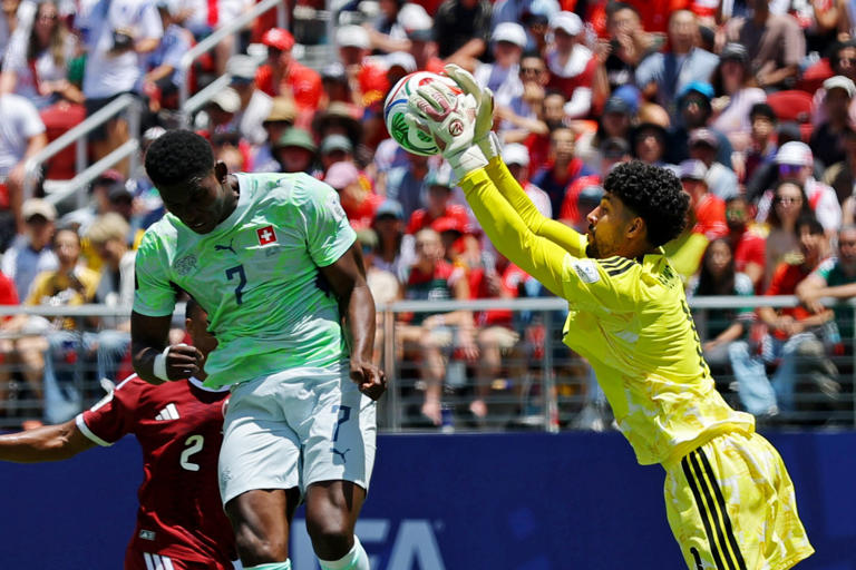 Qatar earn first World Cup point with late leveller against Switzerland
