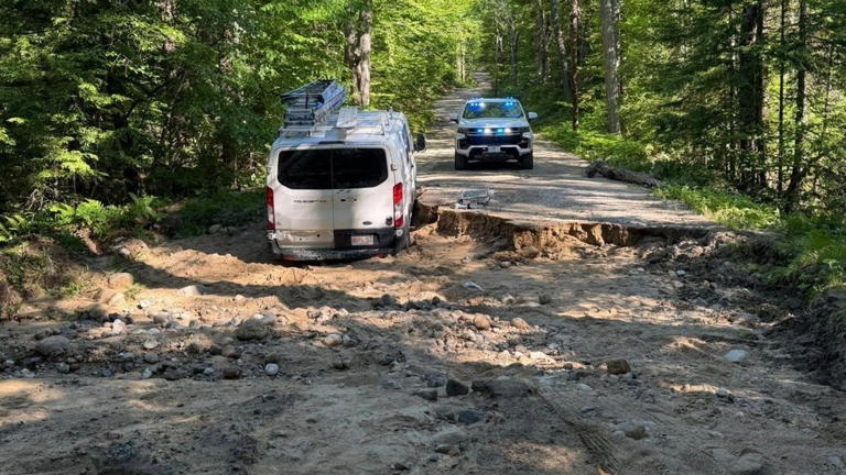 Washed-out Madison, NH roads trap van as storm damage lingers