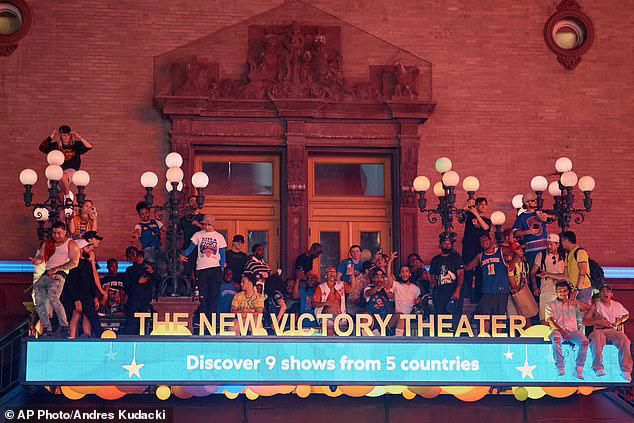 New York descends into chaos as fans jump on cop cars and buses after ...
