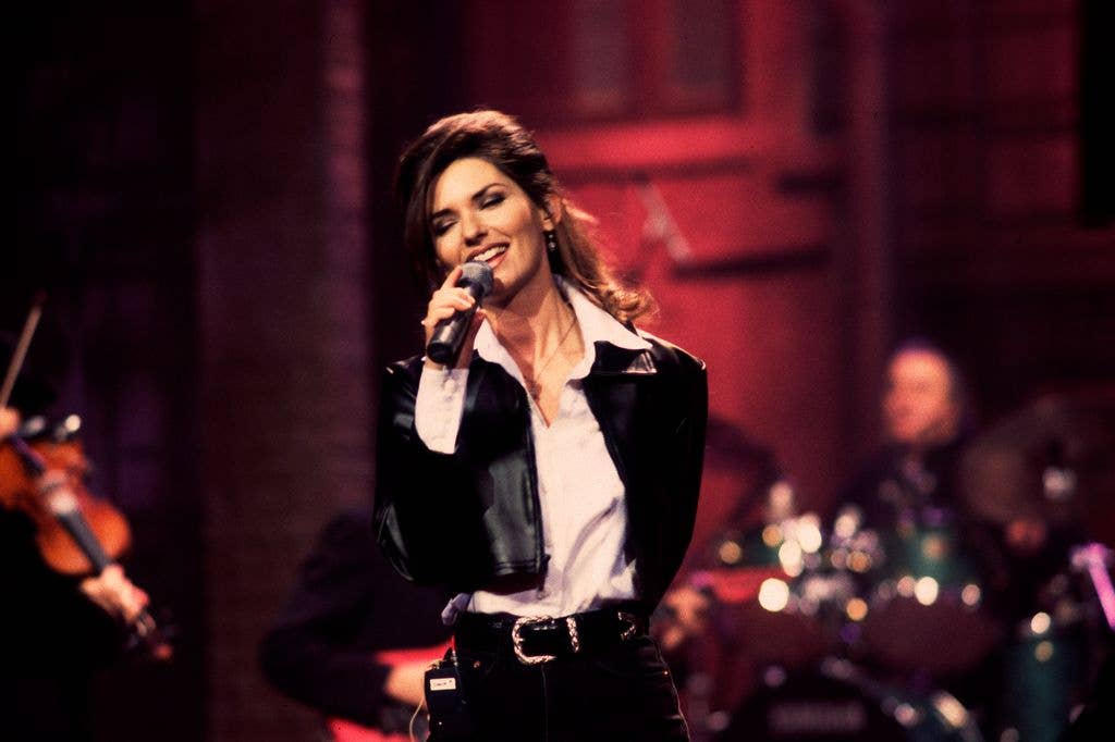 Shania Twain, 60, stuns in corset and hotpants as she takes to Wembley ...