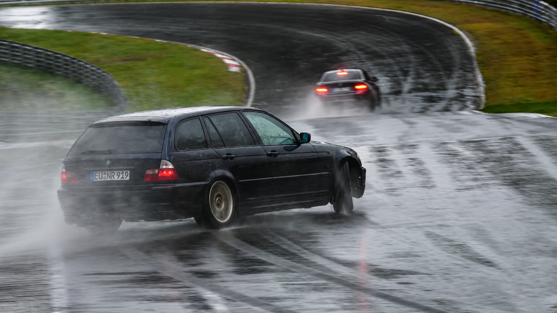 BMW E46 wagon slides off during slippery track run
