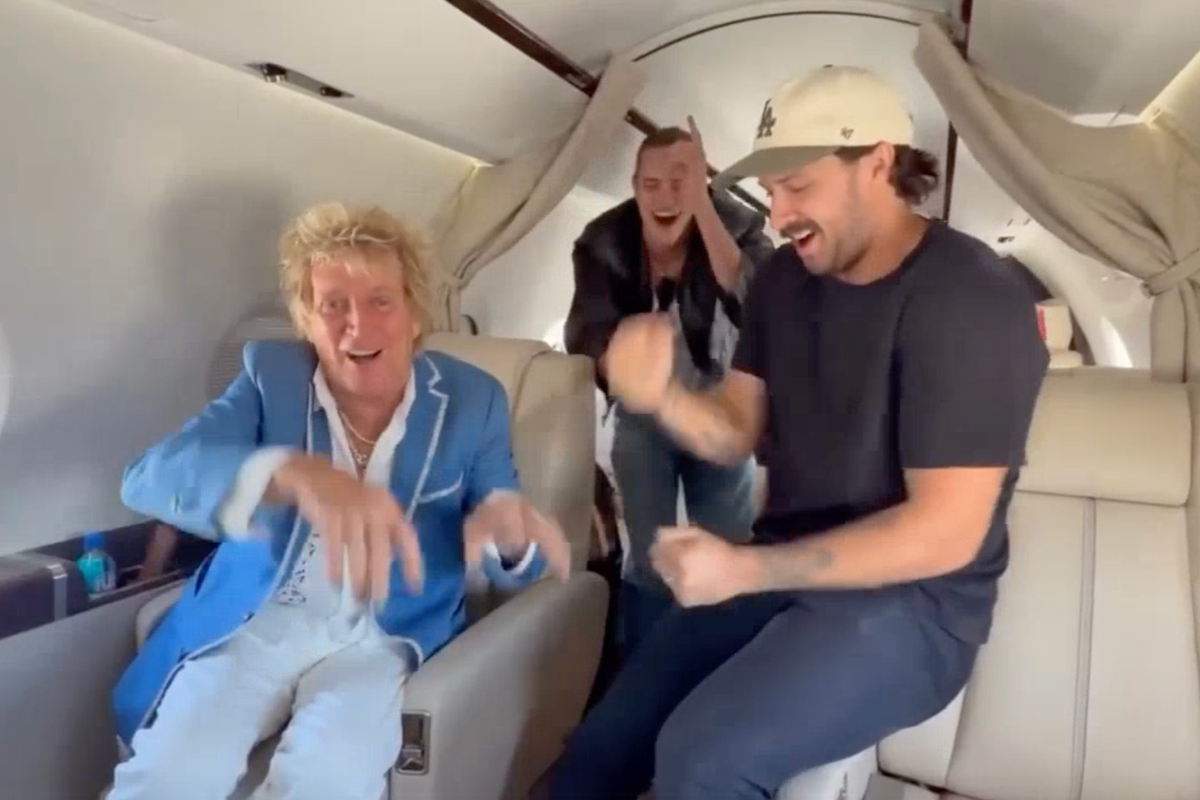 Rod Stewart parties on way to watch Scotland after cancelling show