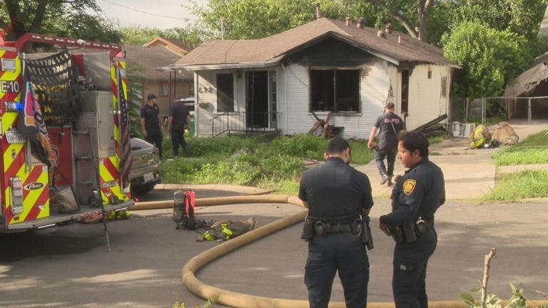 Electrical short in window AC sparks house fire; residents escape uninjured