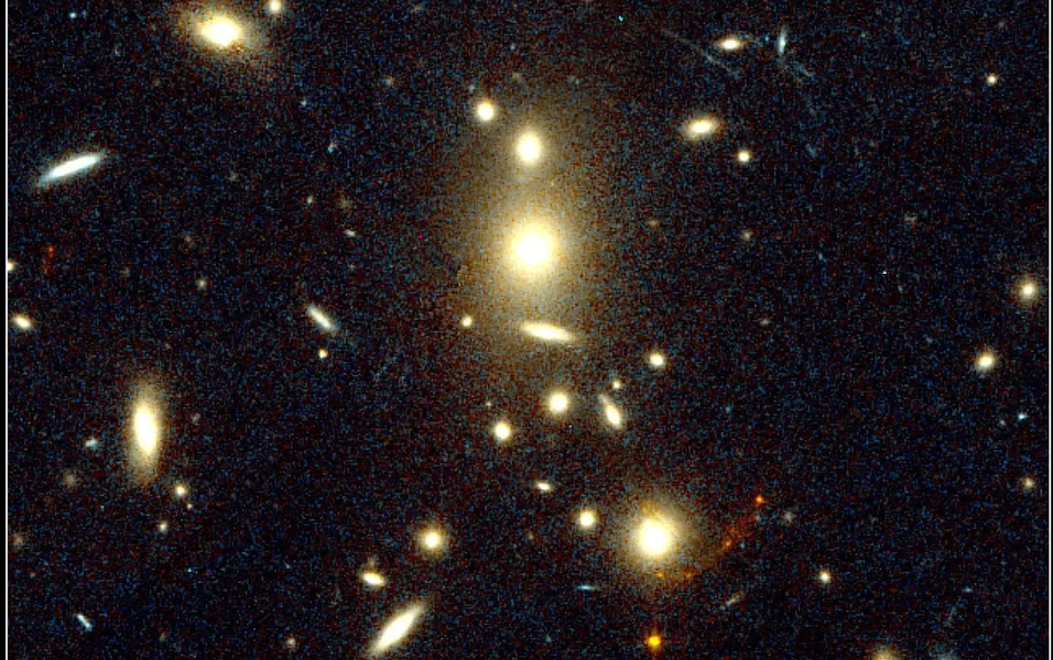 Hubble captures galaxy cluster bending light across universe