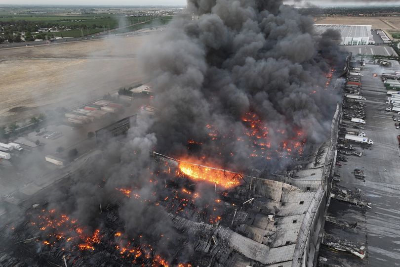 Residents told to stay indoors as toxic smoke from massive fire engulfs ...