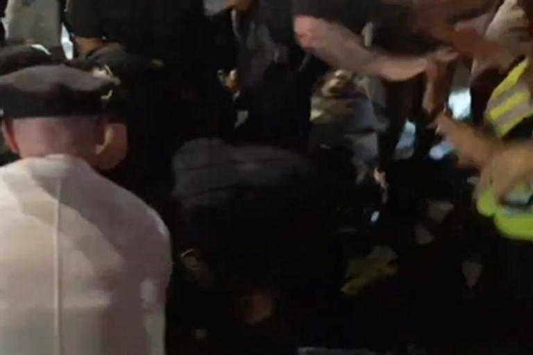 Riot police chase Knicks fans who smash up NYPD car as New York ...
