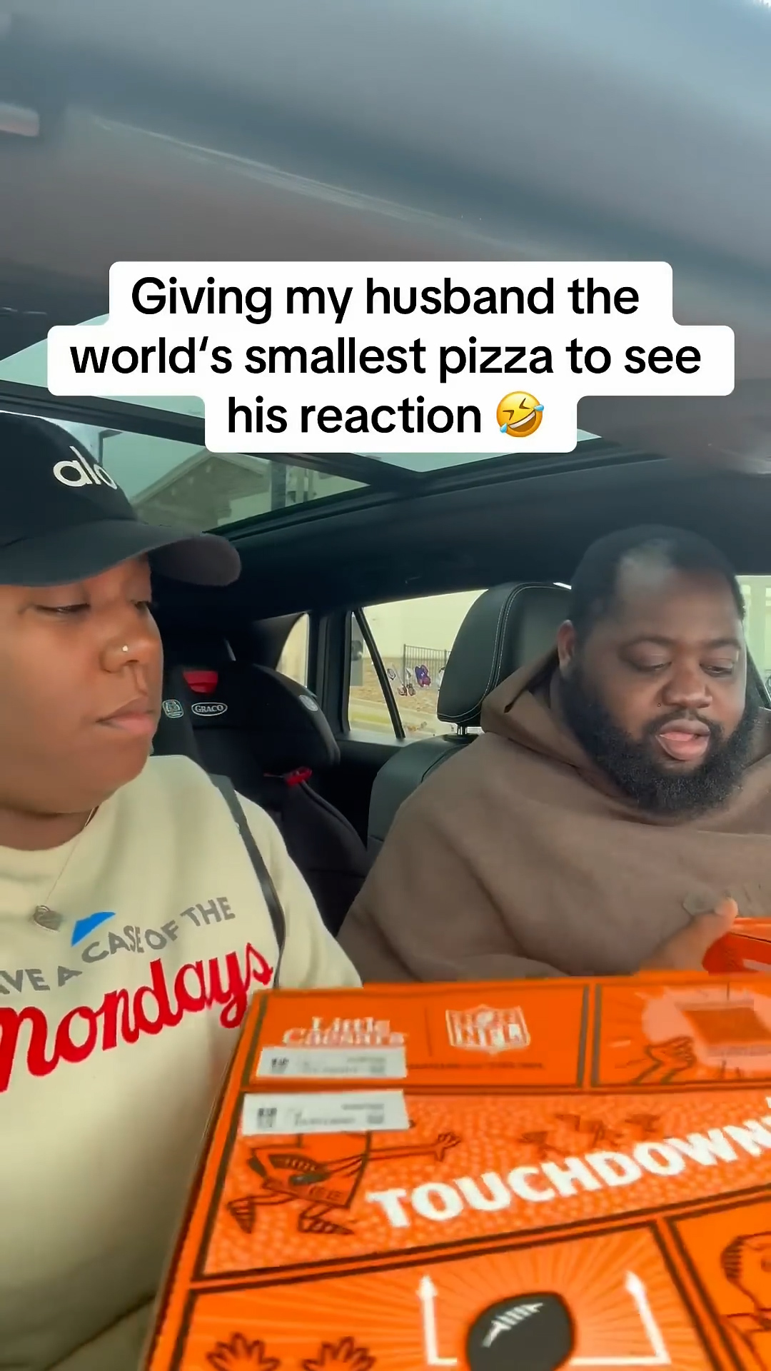 Handing my husband the tiniest pizza ever to see his confused reaction