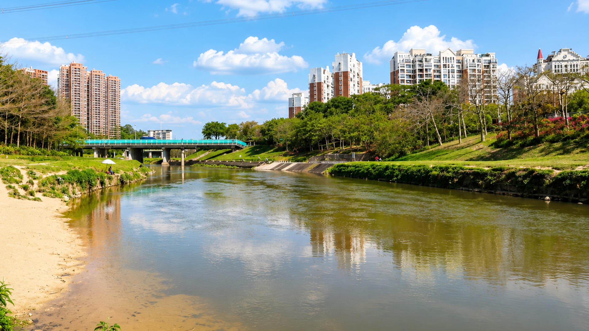 China’s quiet riverside reveals a beachlike escape beside apartment towers