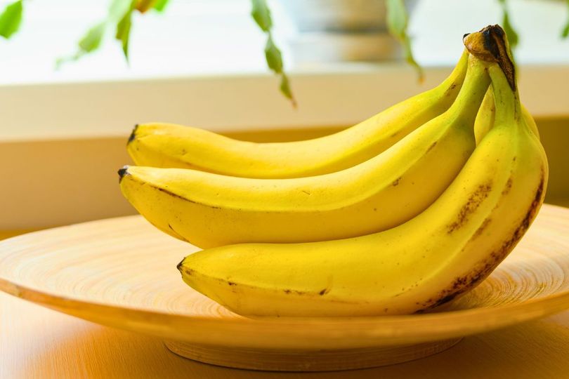Bananas will last longer without turning brown if stored alongside ...