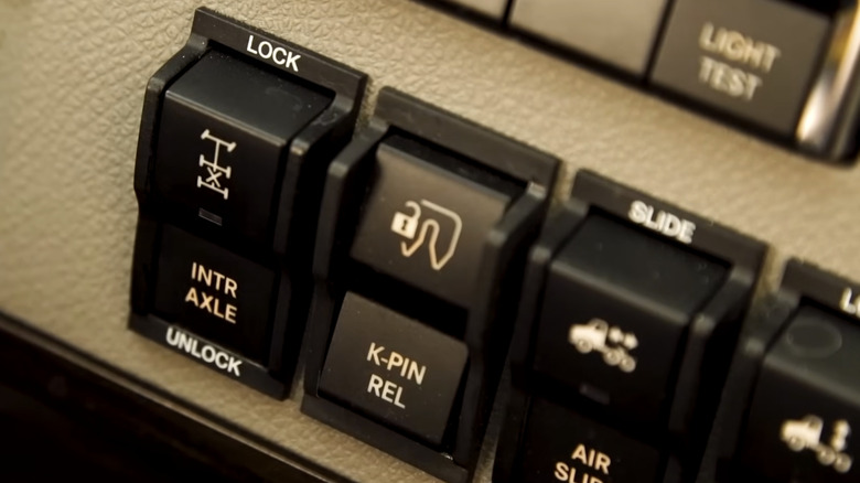 What the 'power divider' switch in a semi truck cab actually does to ...