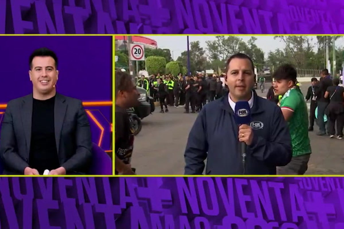 Moment fight breaks out behind World Cup reporter as broadcast cut