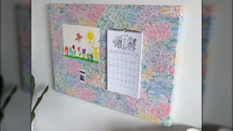 Transform old bed sheets into a practical home decor piece for your wall