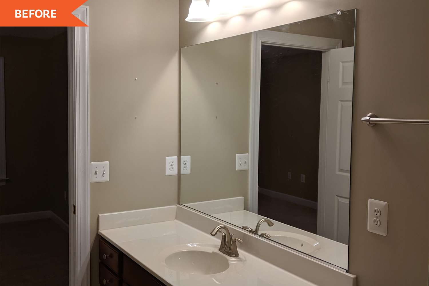 A windowless bathroom got an open and airy redo that's actually functional