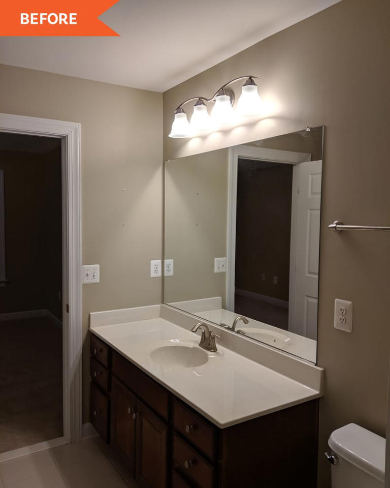 A windowless bathroom got an open and airy redo that's actually functional