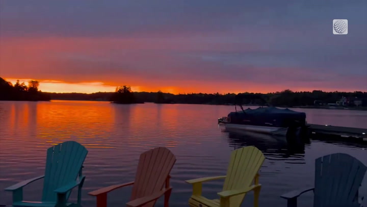 Vibrant sunrise over a calm Ontario lake