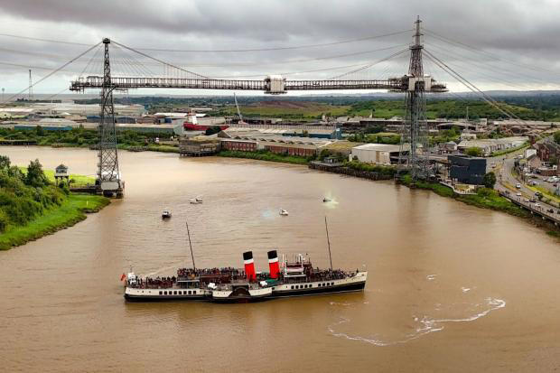 World's last seagoing paddle steamer sails under Newport's iconic bridge