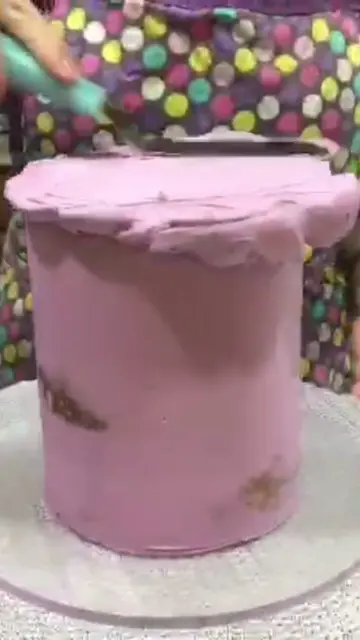 Watch this pink drip cake transform into a donut lovers dream