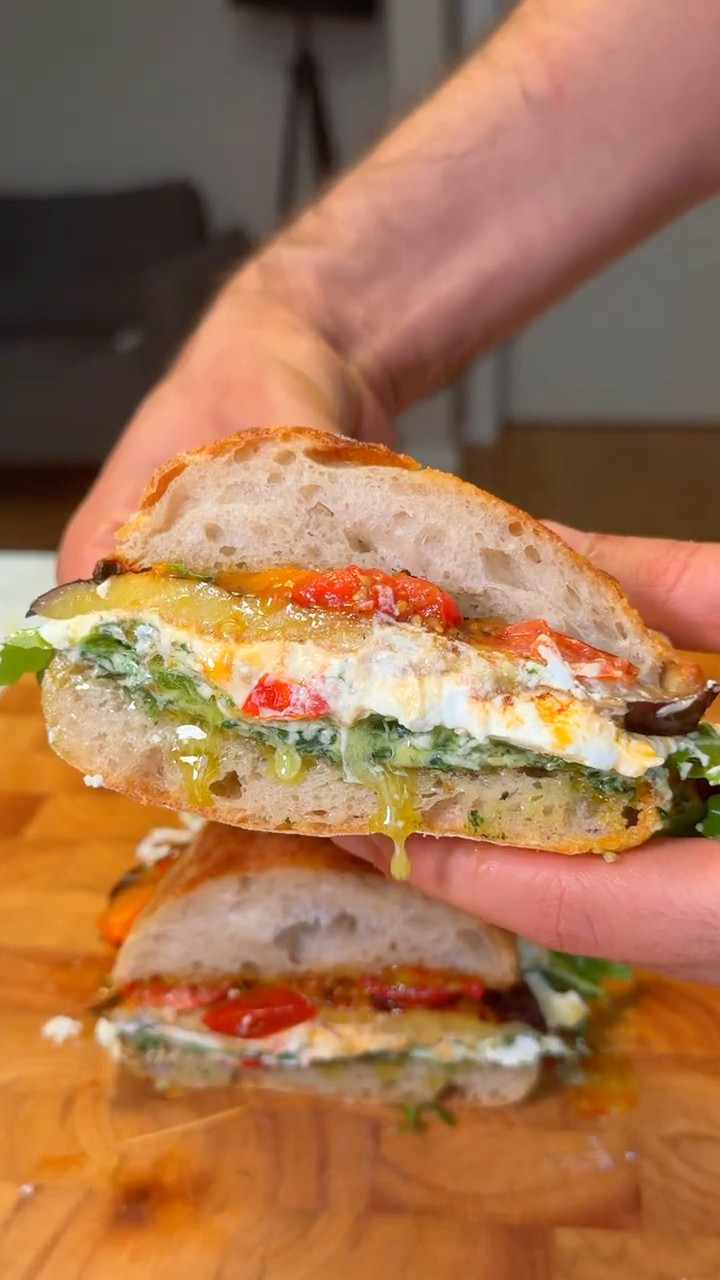 Grilled eggplant pesto sandwich on toasted artisan bread