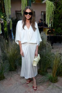Brooks Nader takes kitten-heel flip-flops after dark at Quay