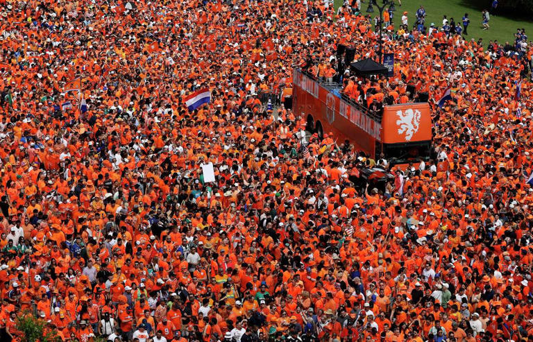 Photos: Dutch Orange Bus leads parade of Netherlands fans to Dallas Stadium