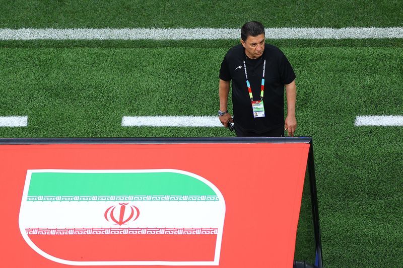 Soccer-Iran's manager, striker pledge to play for all Iranians despite ...