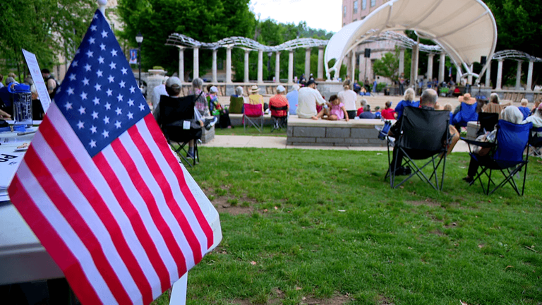 Community members gather in Pack Square Park for 'No Kings' event
