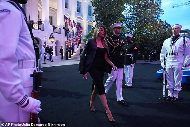 Melania stuns in black at White House UFC event as dark clouds gather ...