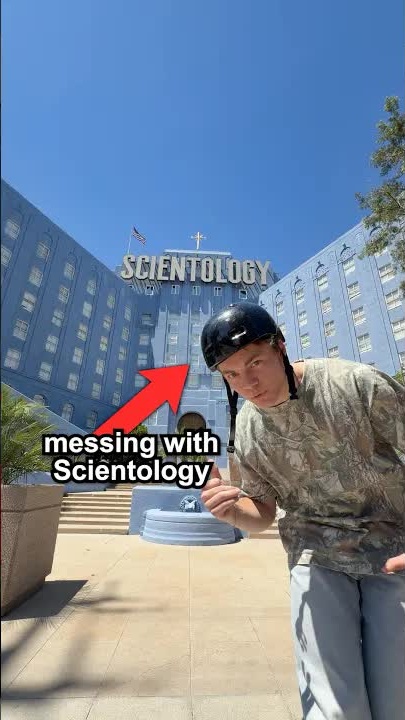 Risky scooter tricks near Scientology building