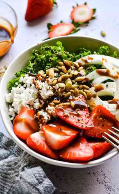Strawberry and kale salad fresh colorful and so satisfying