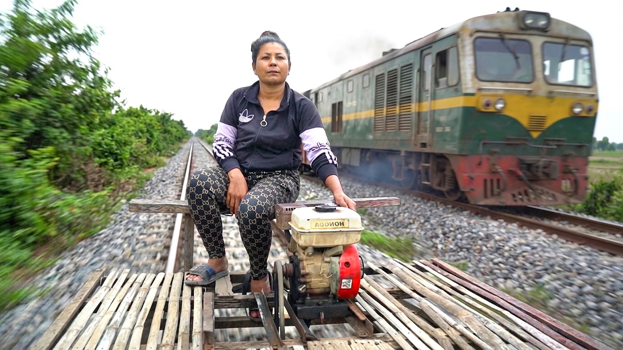 Riding the craziest bamboo train in the middle of massive trains