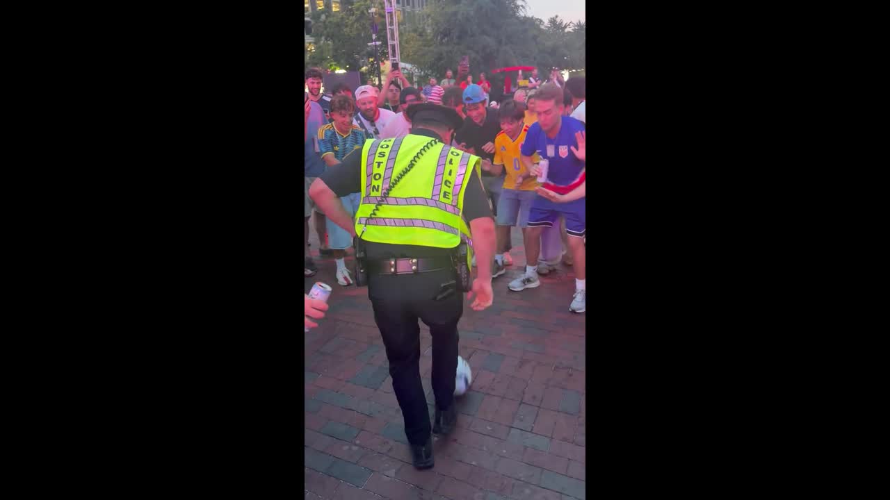 Police entertain crowd with football skills in Boston ahead of World ...