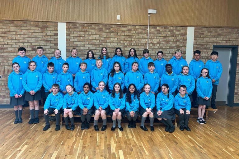 Mid Ulster P7 pupils pose for their final class photos