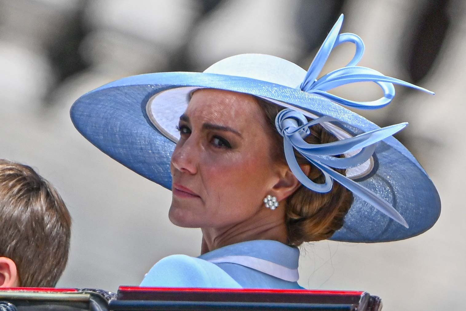 Kate glares at anti-monarchy protesters booing her and the children