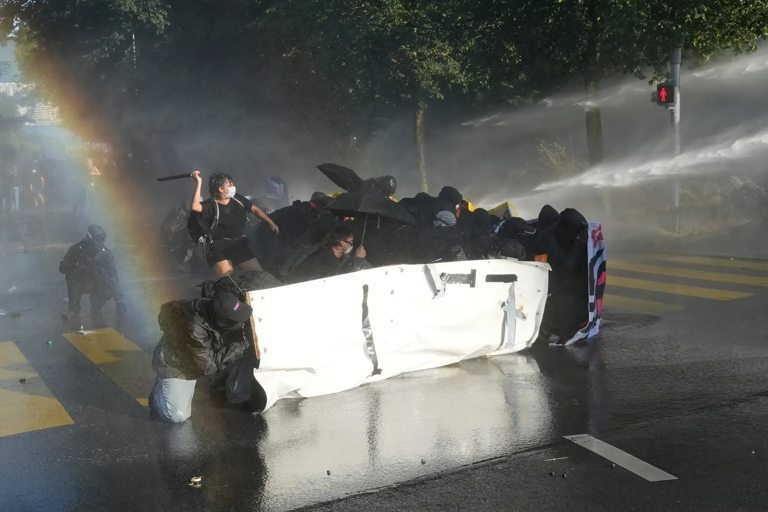 Tear gas, burning Tesla and smashed windows: 20,000 protest G7 summit ...