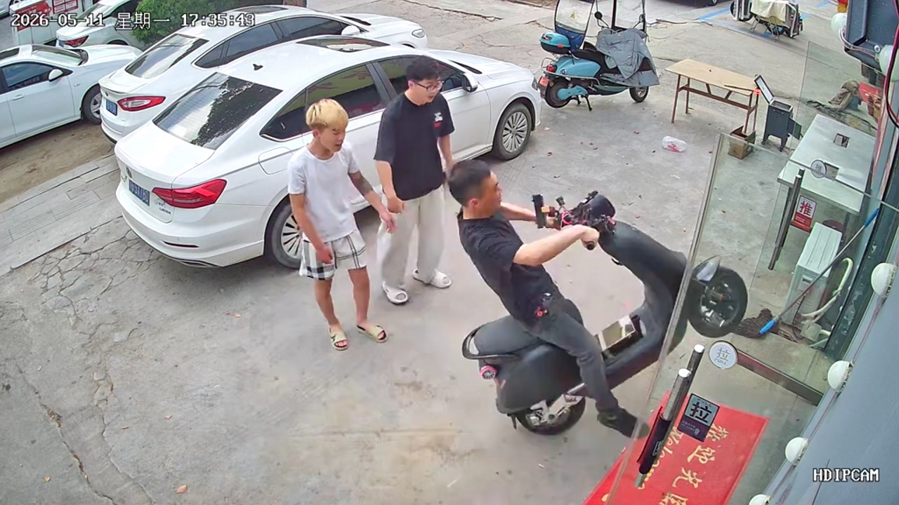 E-scooter wheelie gone wrong crashes into glass door!
